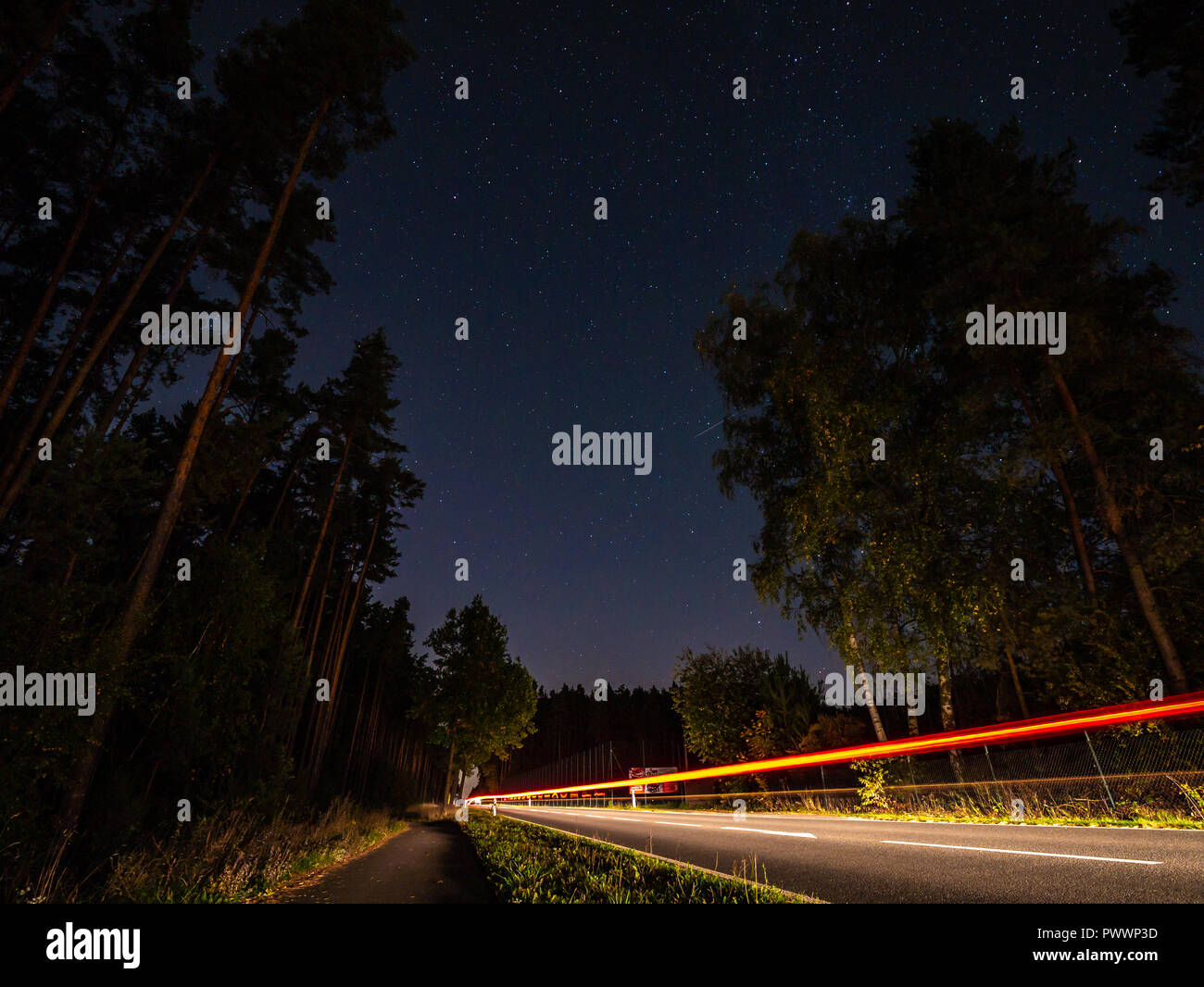 Light strips at night on a clean sky with stars Stock Photo - Alamy