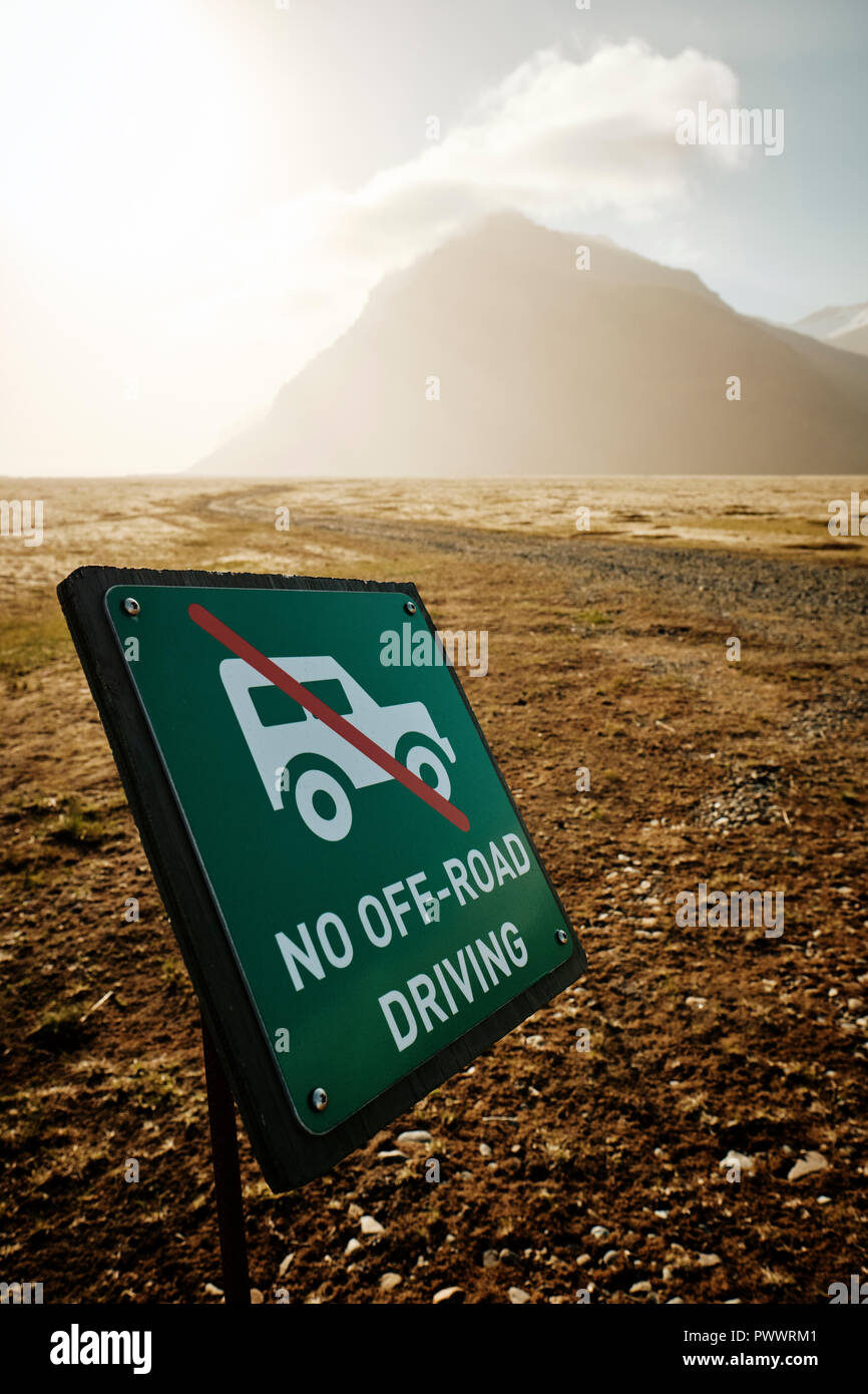 A "no off-road driving" sign in the remote mountain and plain landscape ...