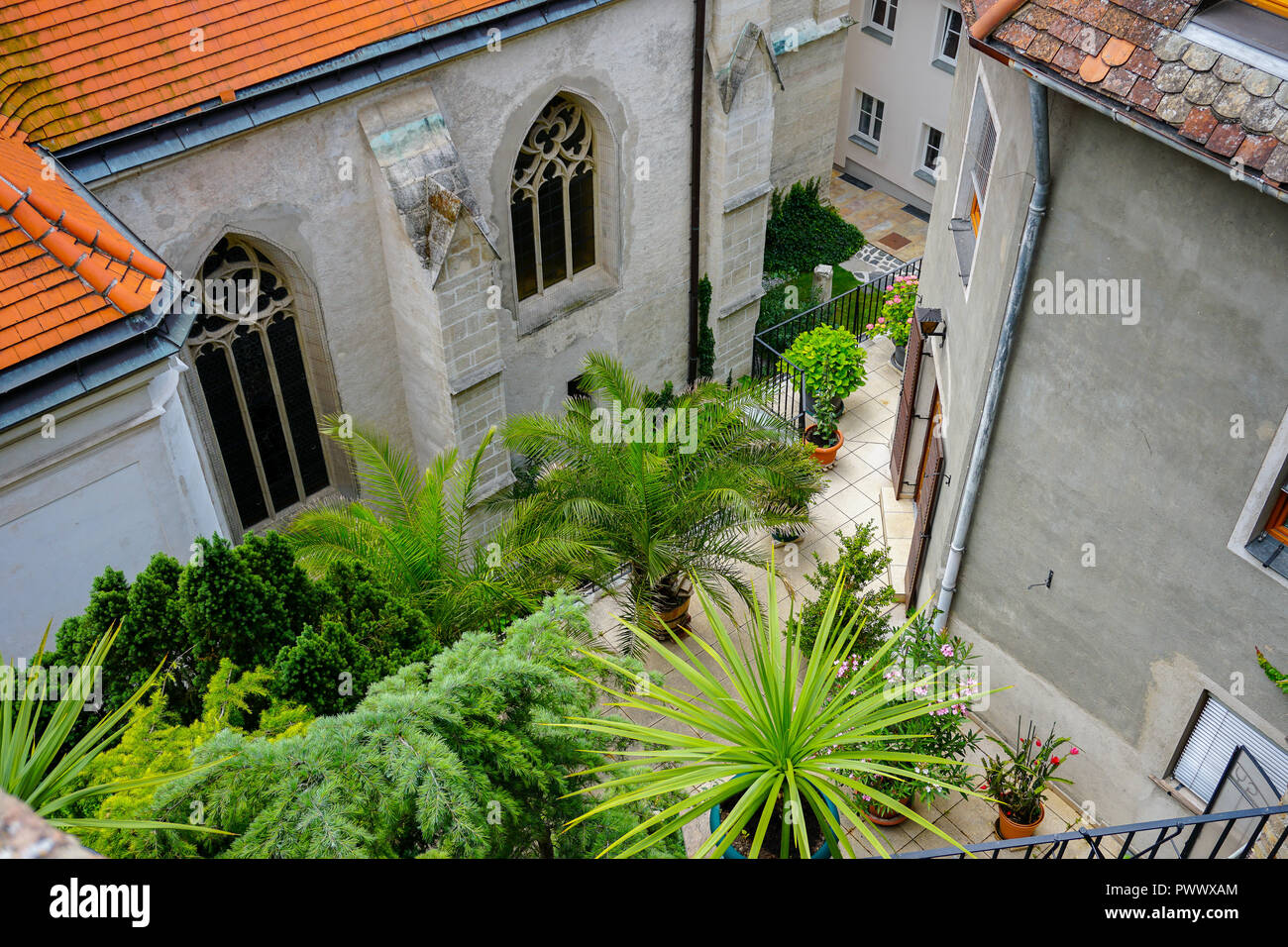 Austrian buildings with red roofs and plants in yard Stock Photo - Alamy