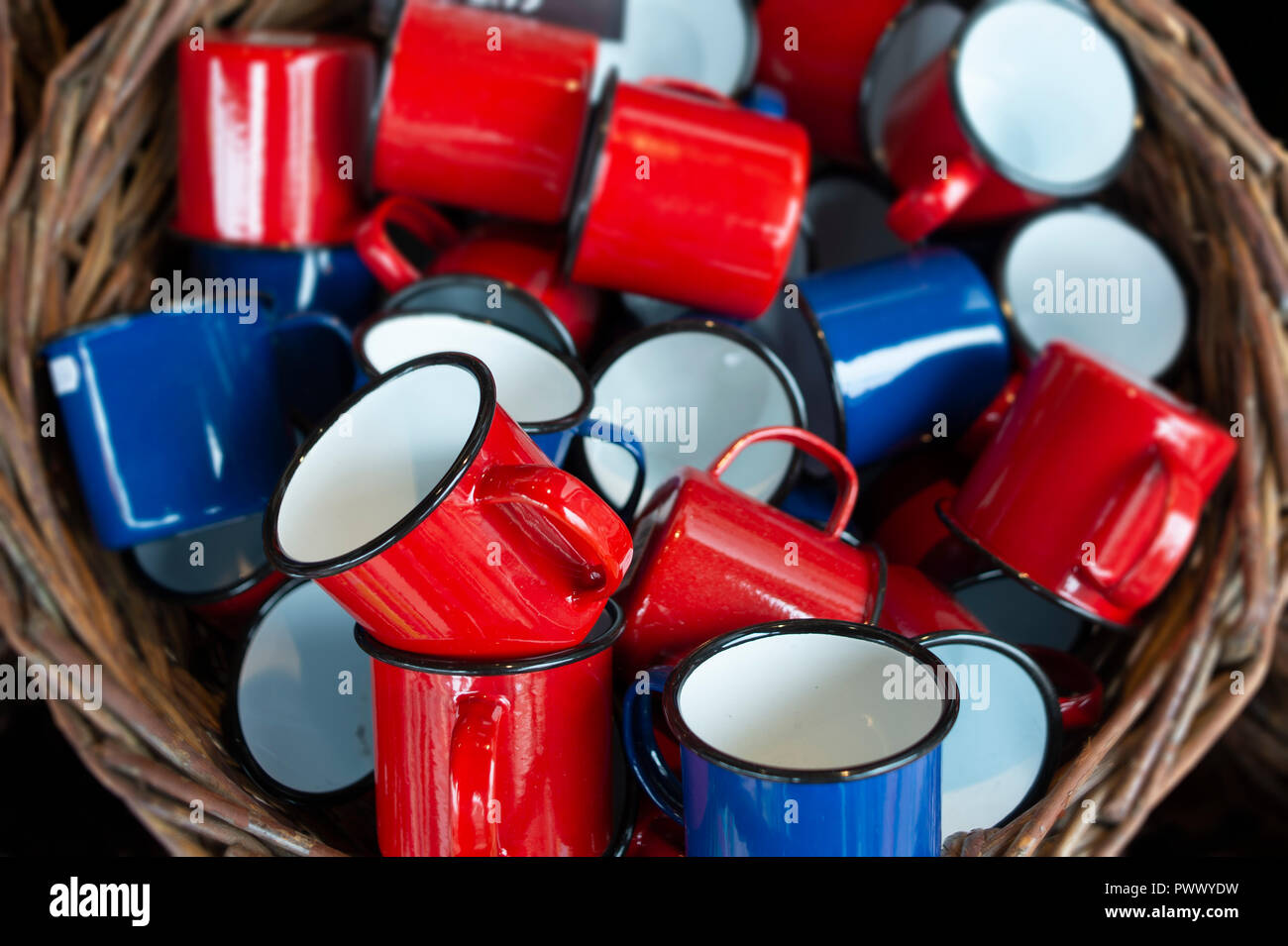 red and blue enamel mugs Stock Photo - Alamy