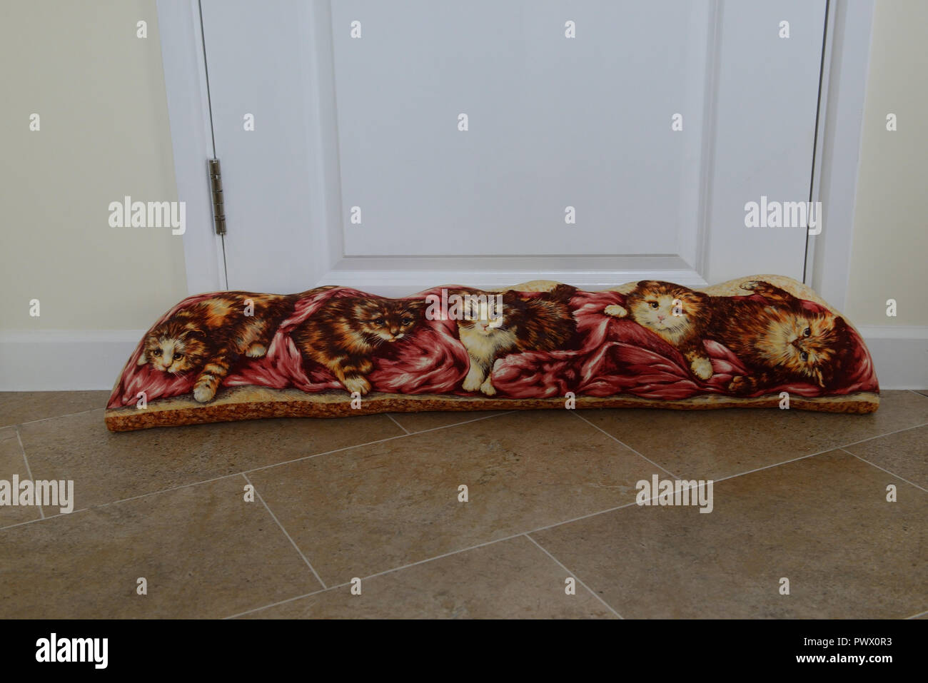 Draught excluder hi-res stock photography and images - Alamy