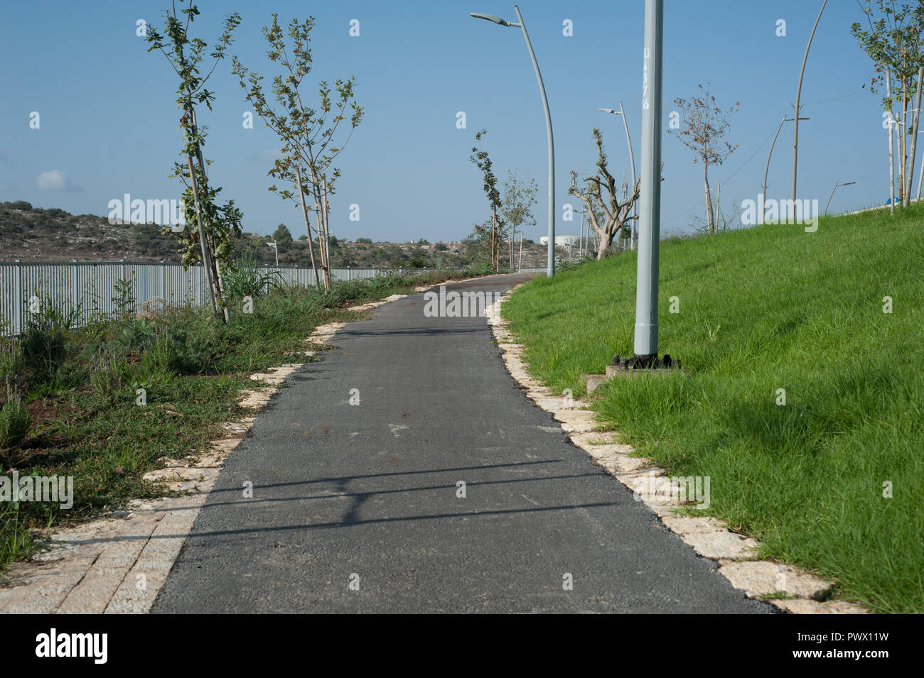 garden path, green area, Modiin City Stock Photo - Alamy
