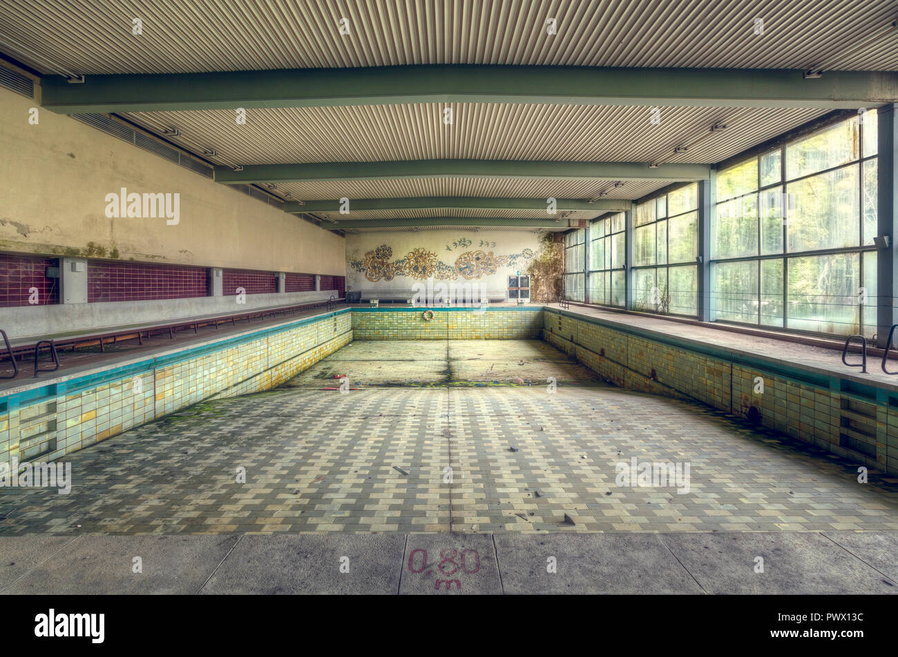 Interior view of an empty swimming pool in an abandoned hotel in ...