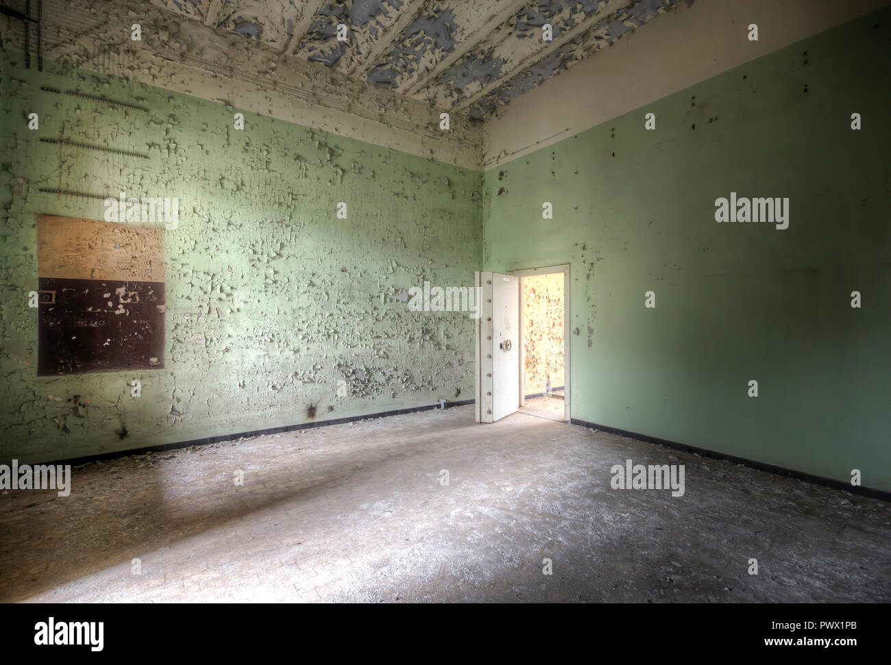 Interior view of a green colored room in an abandoned prison in Belgium ...