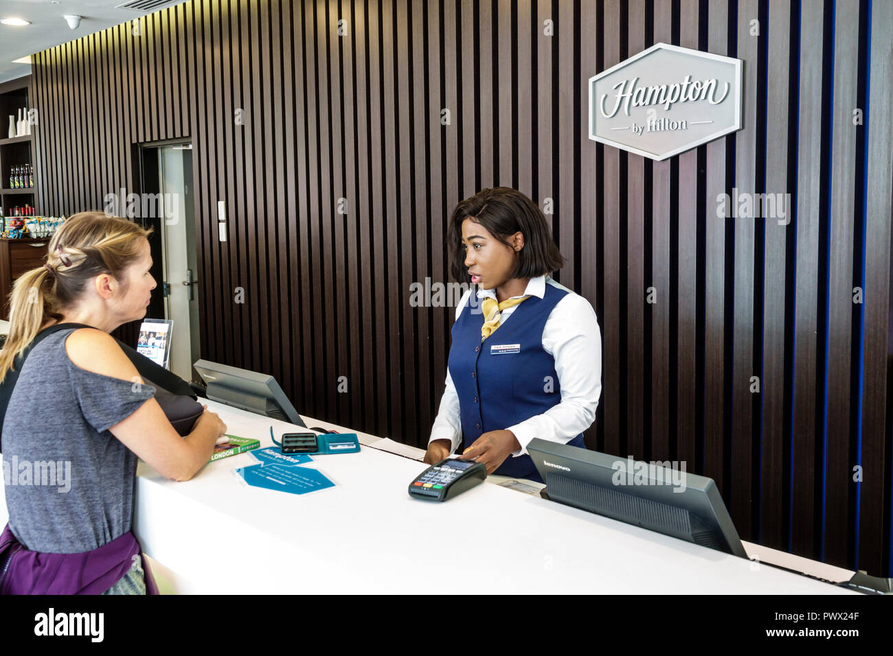 Inside interior lobby front check in reception desk hi-res stock ...