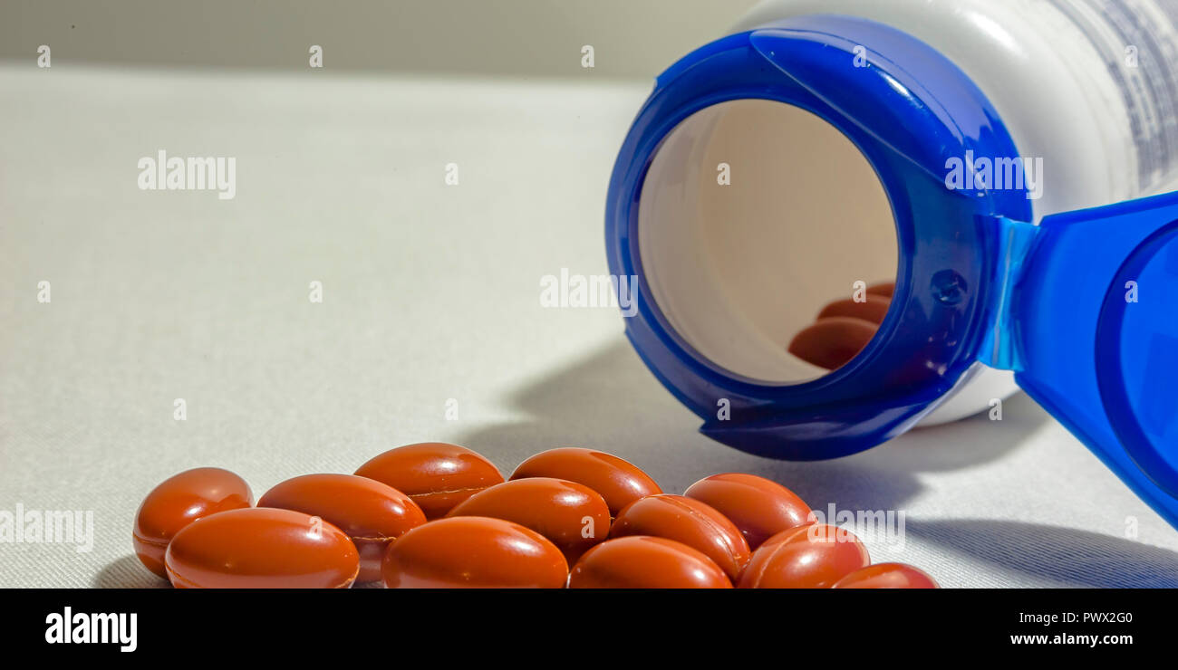Medicine and bottle on textured white background Stock Photo - Alamy
