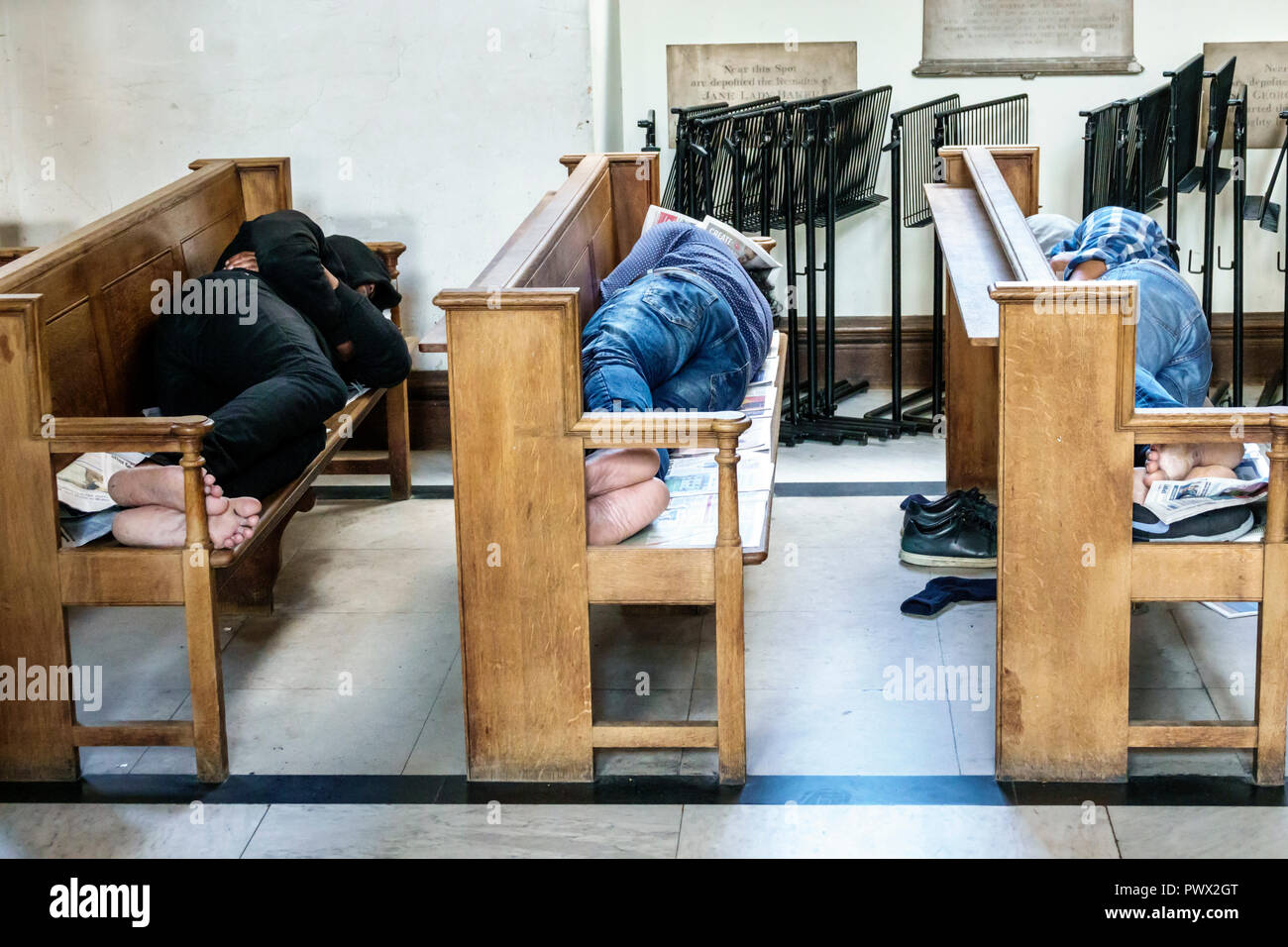 Pews homeless men sleeping christian charity compassion uk hi-res stock ...