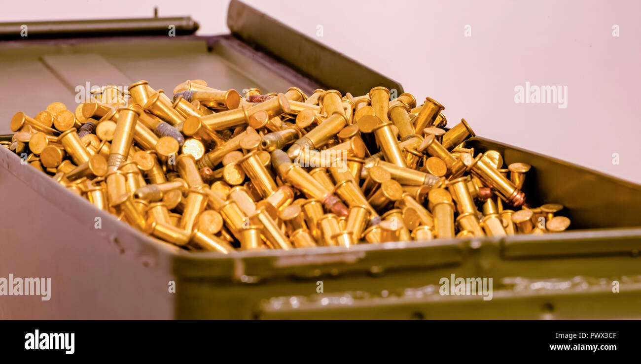 Open metal box full of shiny golden bullets Stock Photo - Alamy