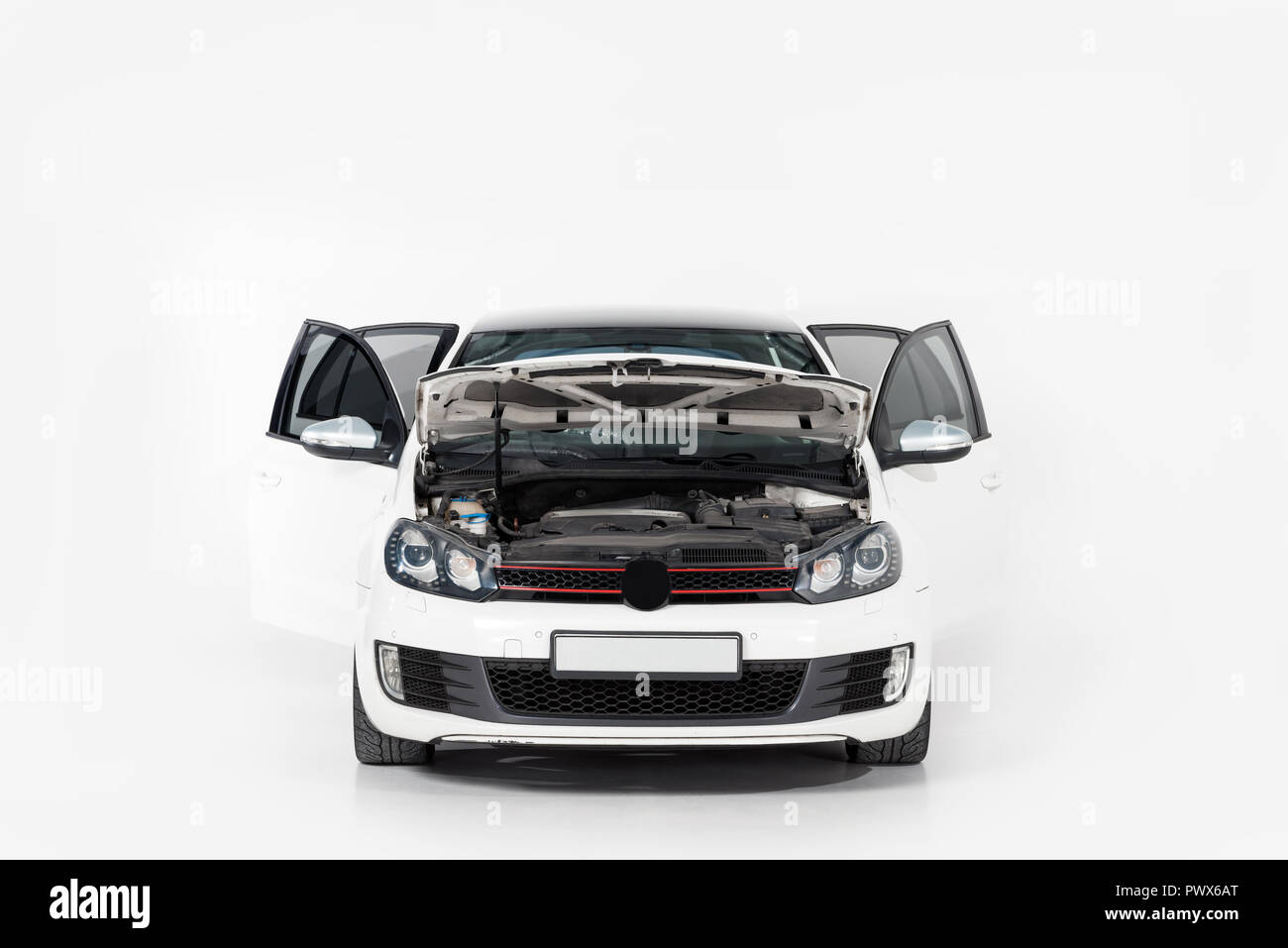 one new white car with open doors and open hood on white Stock Photo ...