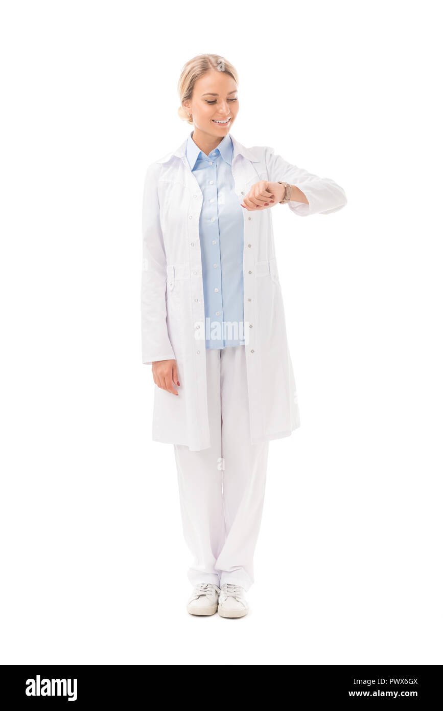 attractive young female doctor checking time with wrist watch isolated ...