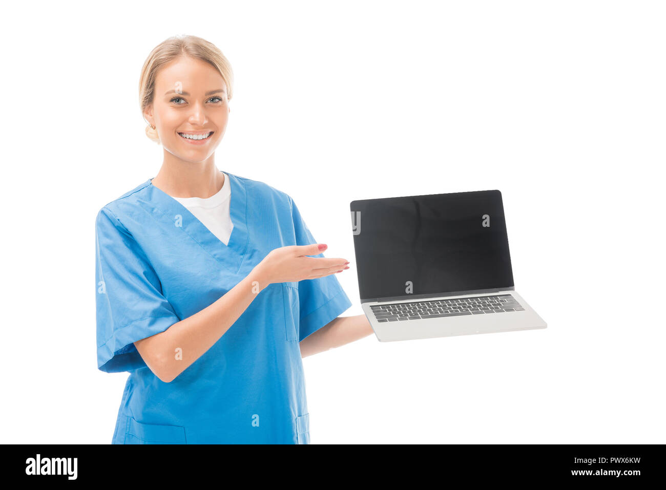 happy young nurse pointing at laptop isolated on white Stock Photo - Alamy
