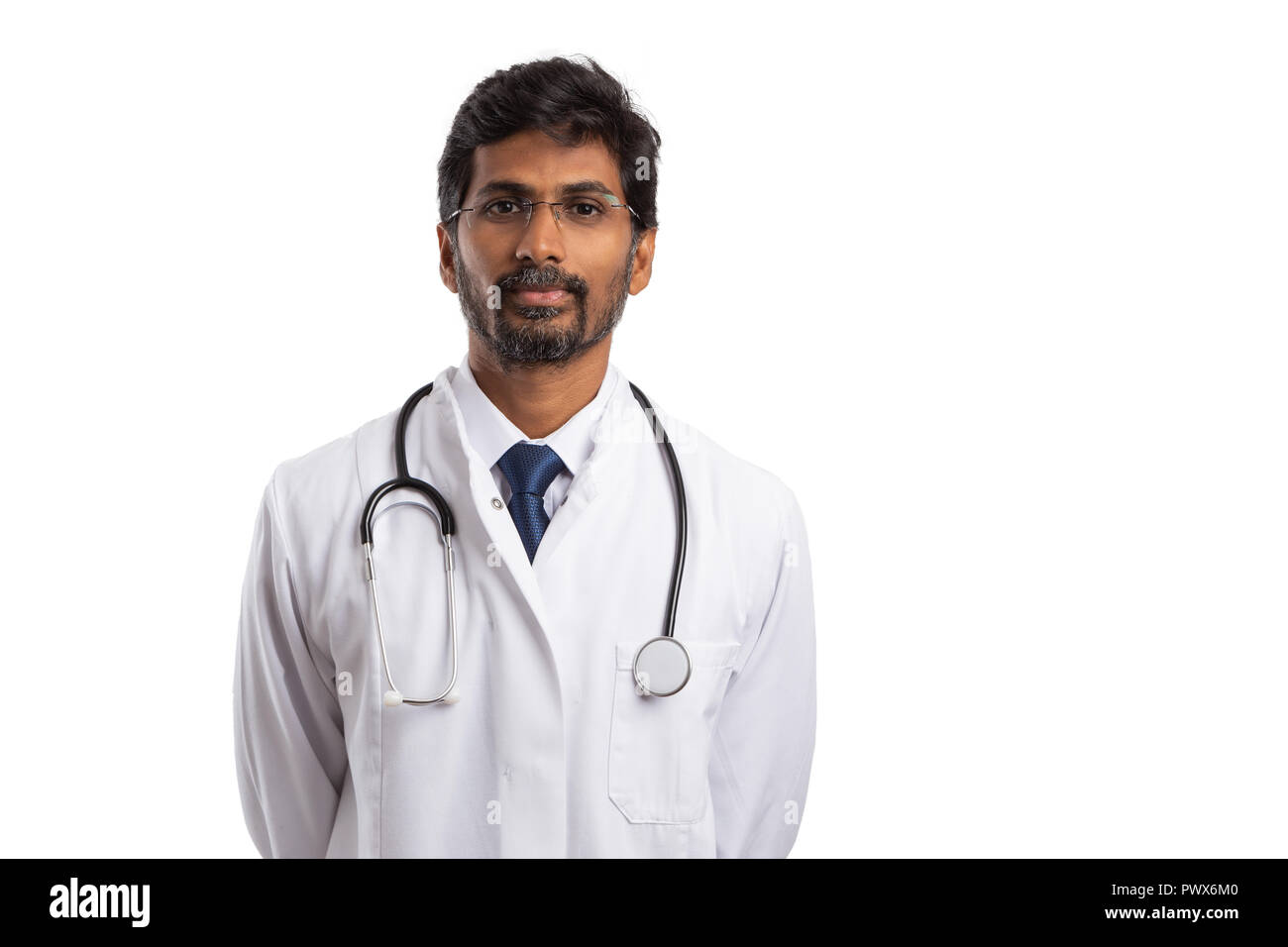 Portrait picture of indian doctor wearing medical coat isolated on ...