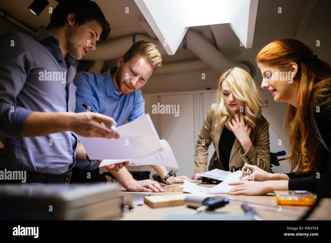 Team working on project together Stock Photo - Alamy