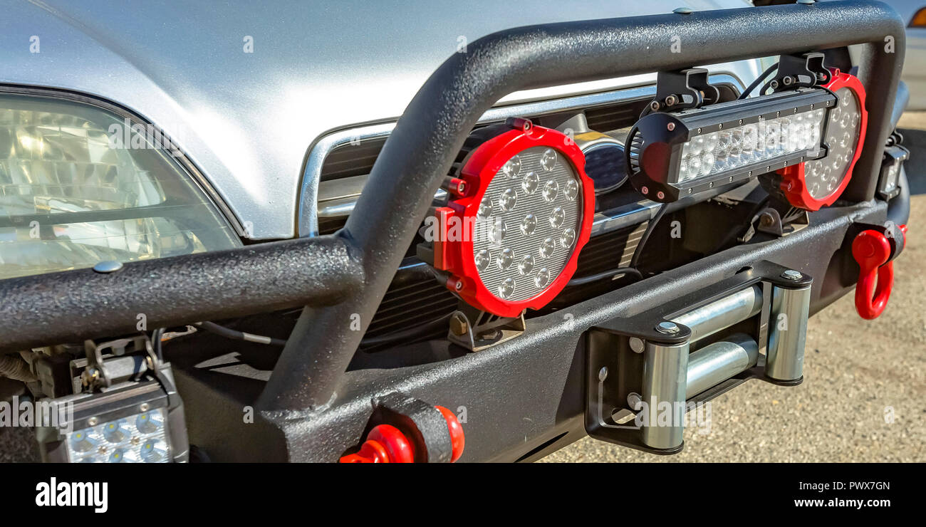 SUV with spotlights and tow hook on grille guard Stock Photo Alamy