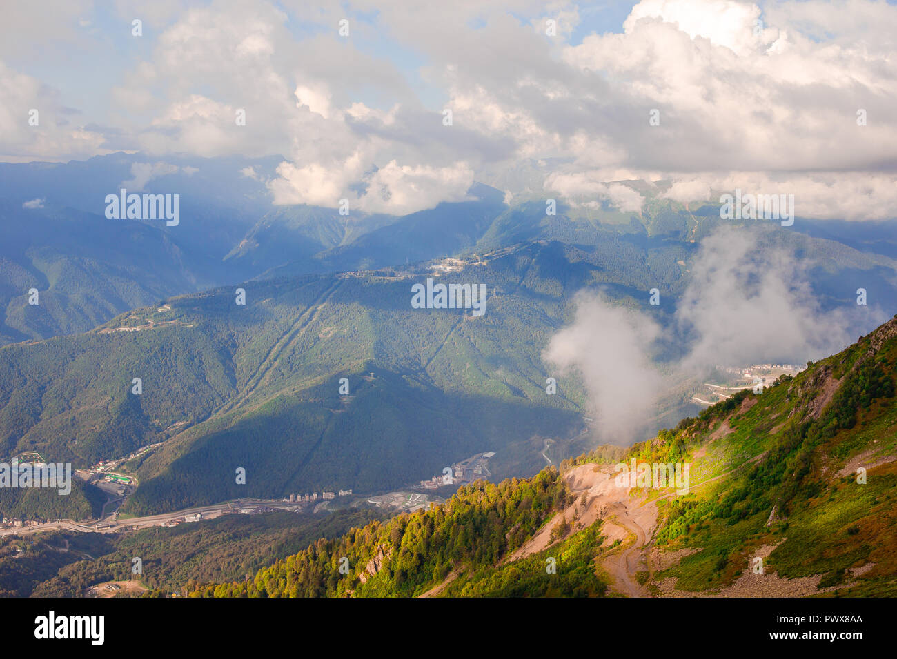 View of the mountains in the warm evening light Stock Photo - Alamy