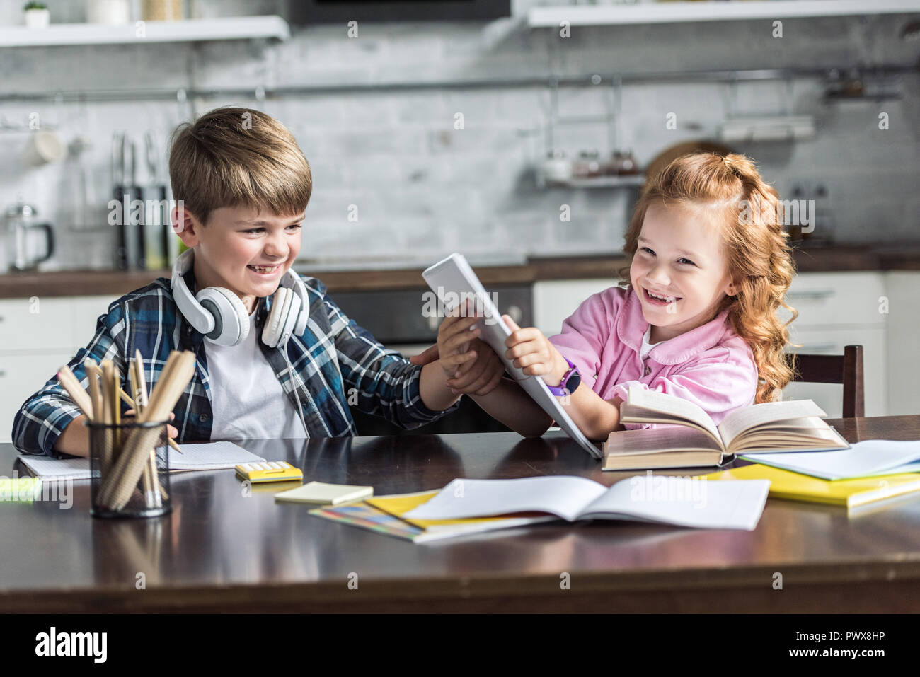 Brother sister doing homework hi-res stock photography and images - Alamy