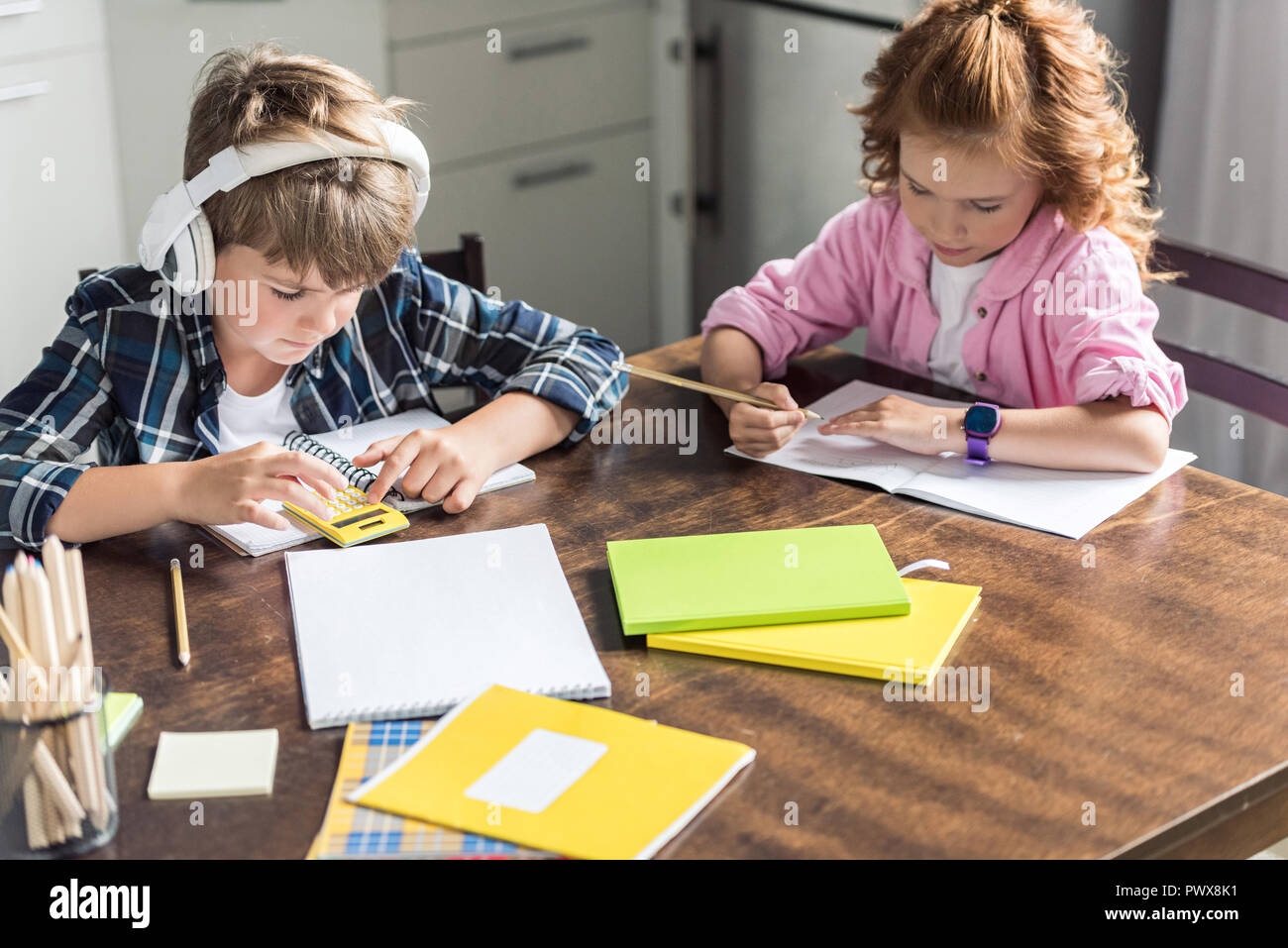 Brother sister doing homework hi-res stock photography and images - Alamy