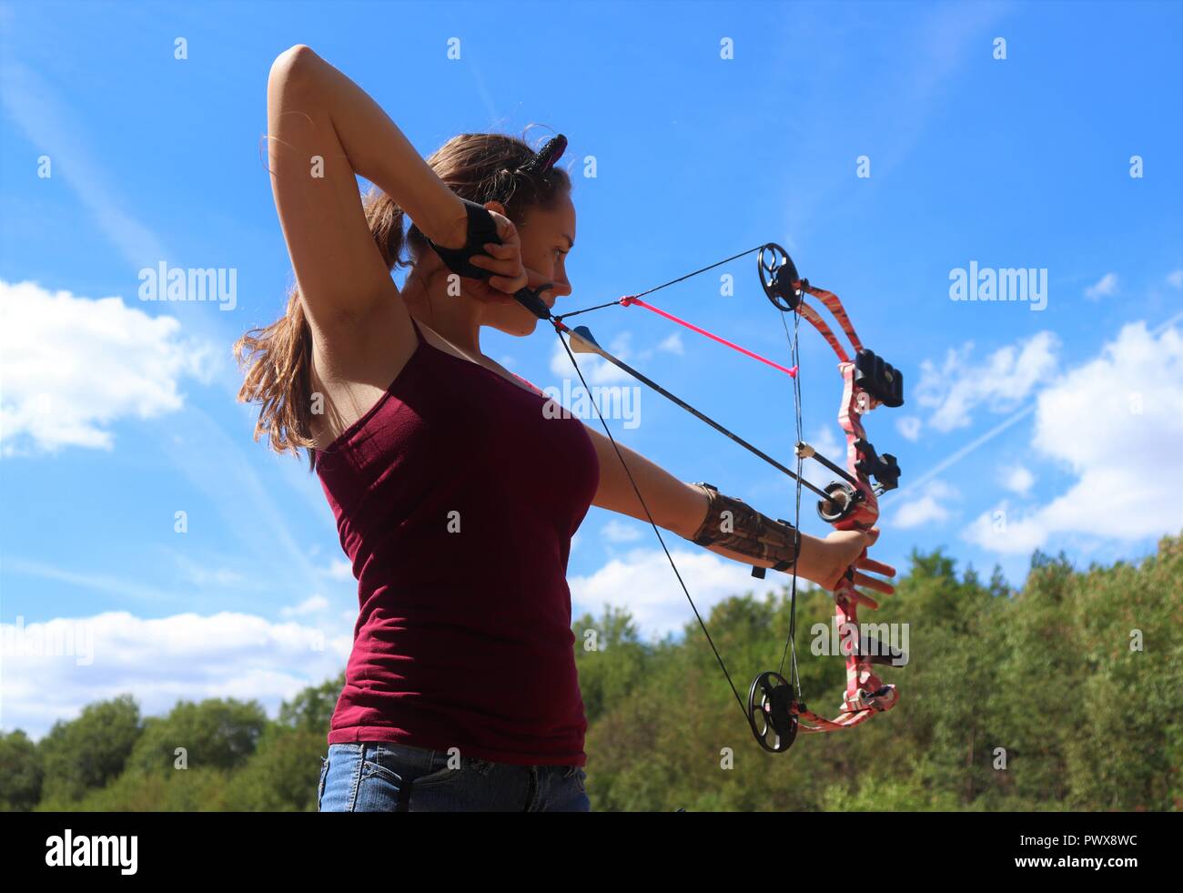 Girl shooting bow hi-res stock photography and images - Alamy