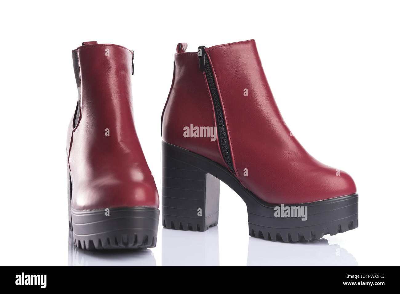 Pair of red platform boots with chunky heels, isolated on white ...