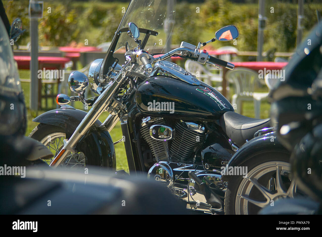 Detail of the tank and engine of a custom black motorcycle Stock Photo ...