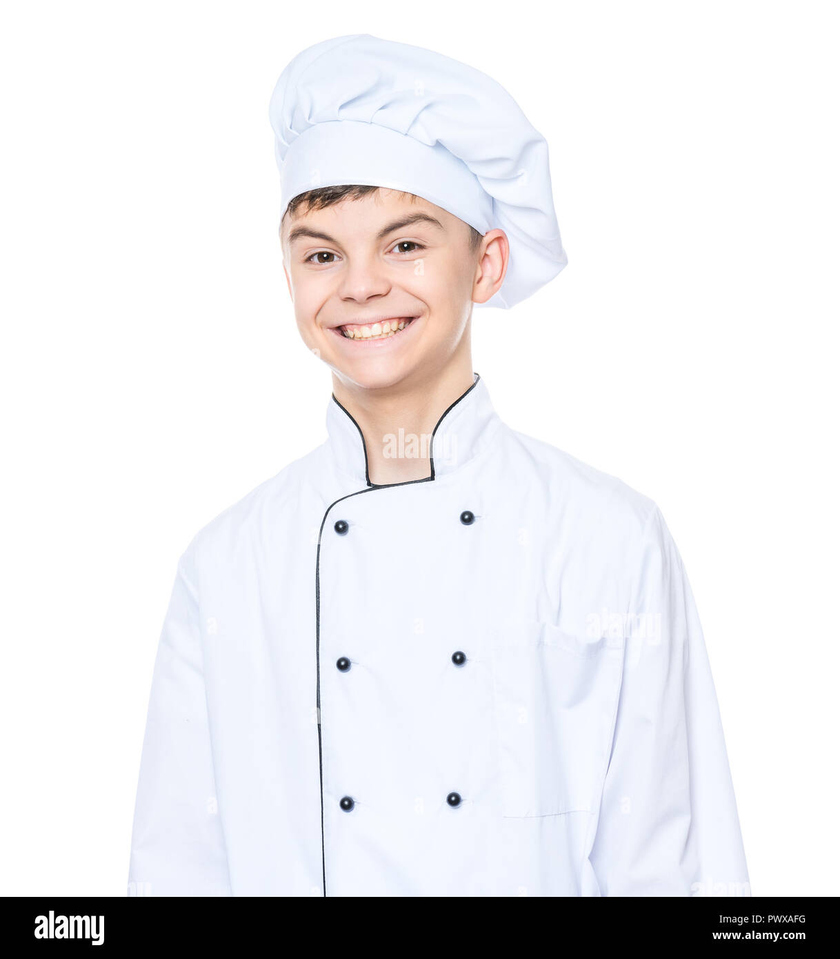 Cheerful handsome teen boy wearing chef uniform. Portrait of a happy ...