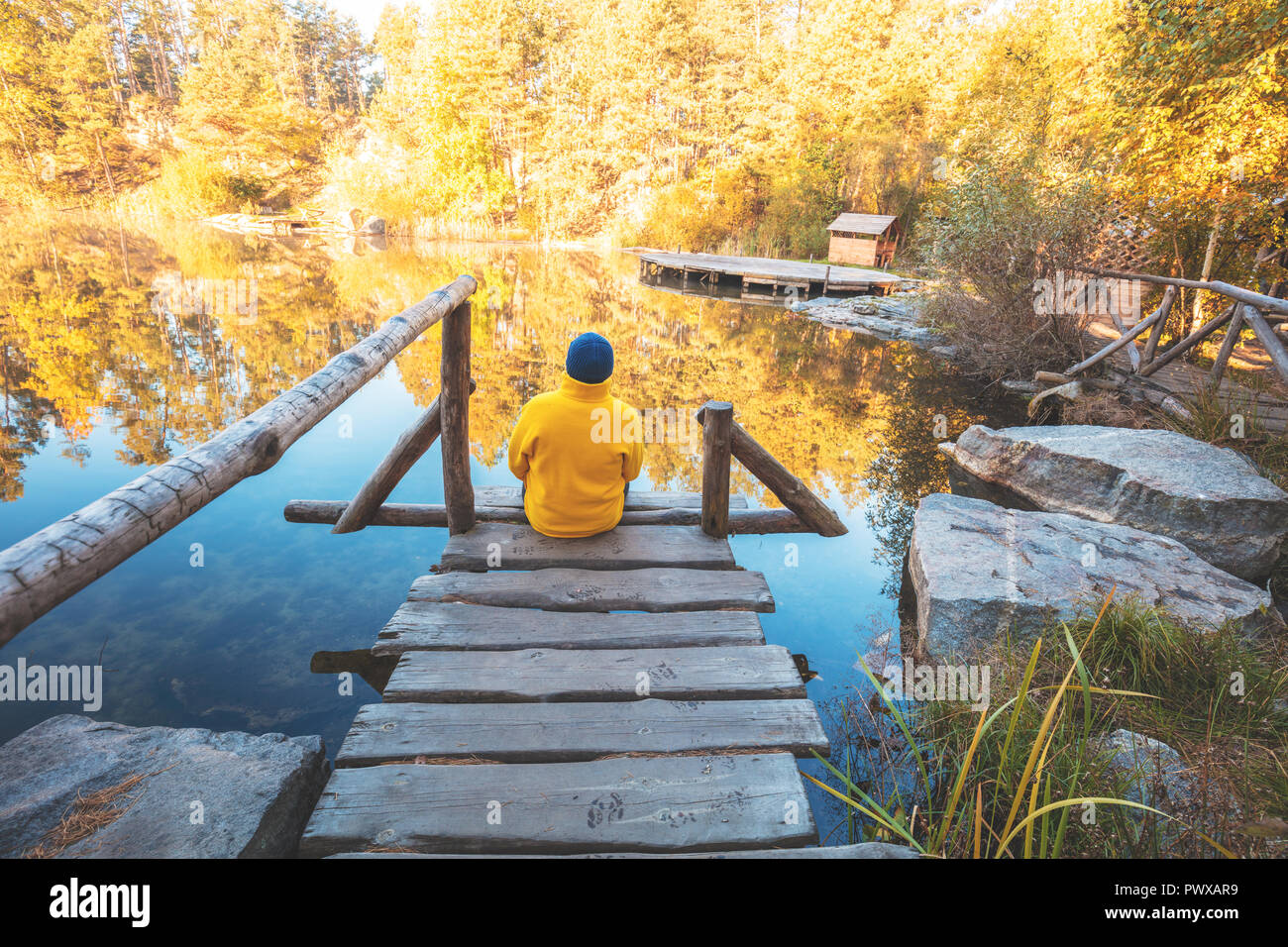 Old man sitting by lake hi-res stock photography and images - Alamy