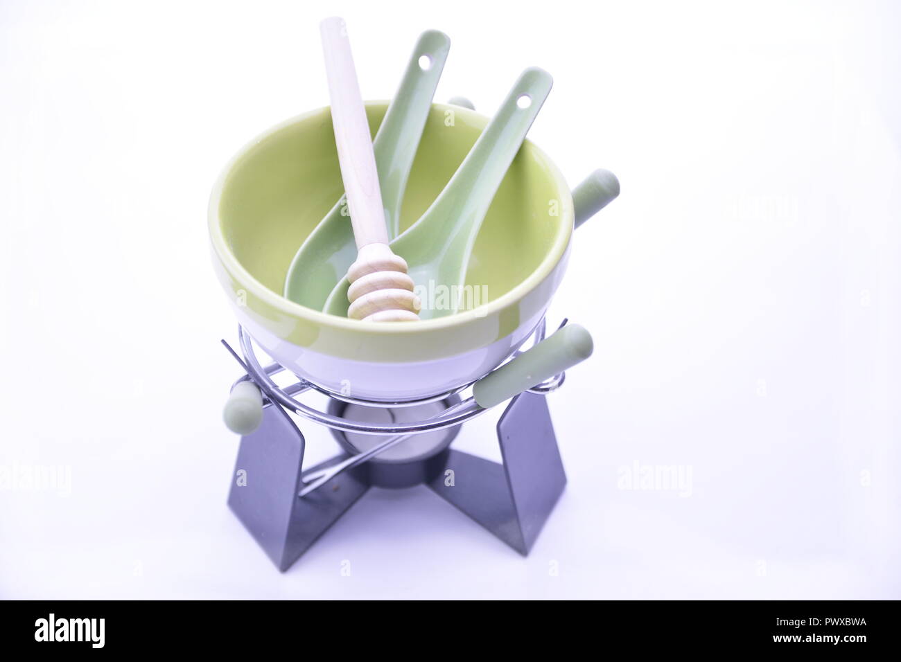 kitchen set, plate, wooden spoon, ceramic spoons on a white background ...