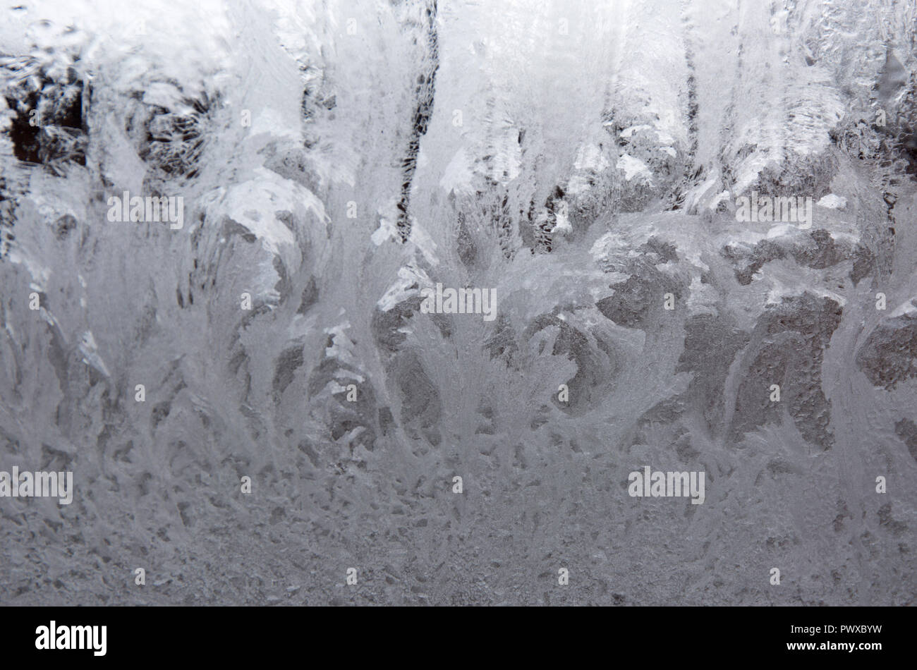 Frosted window winter glass Stock Photo - Alamy