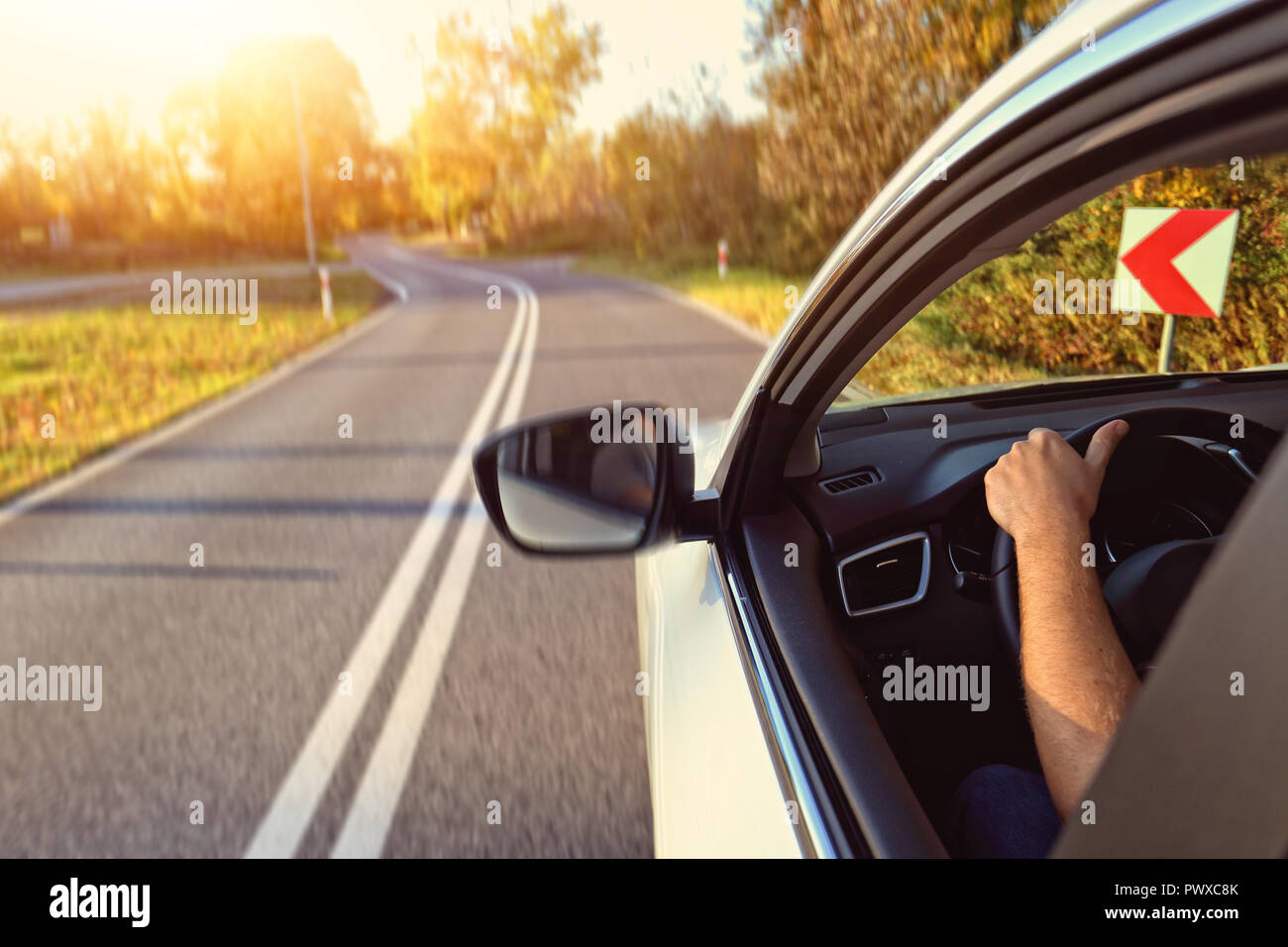 Driving a car on a winding road Stock Photo - Alamy