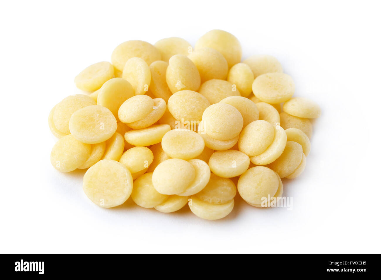 Organic cacao butter buttons (wafers) isolated on white background ...