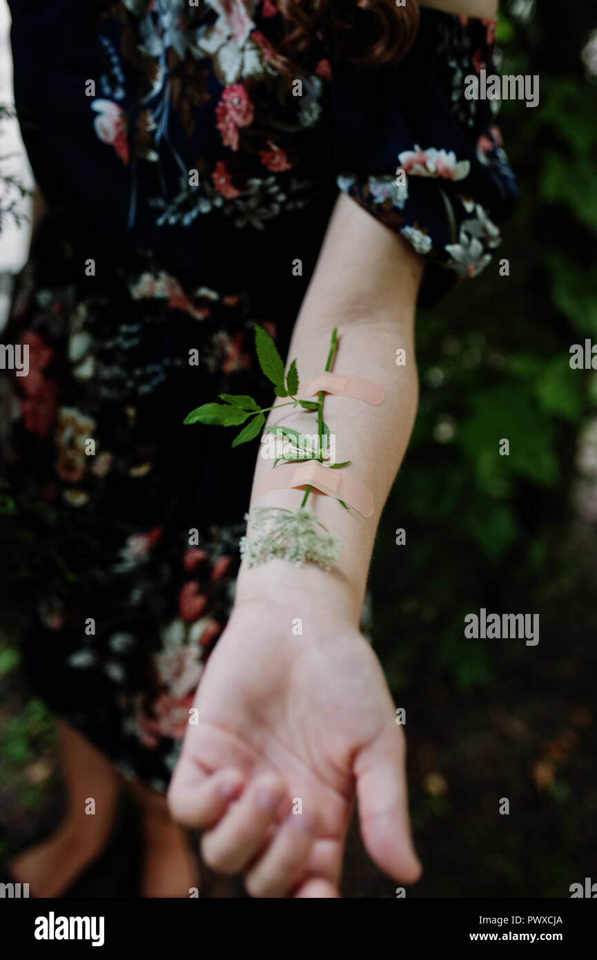 Close-up photo of a flower taped to a female arm Stock Photo - Alamy