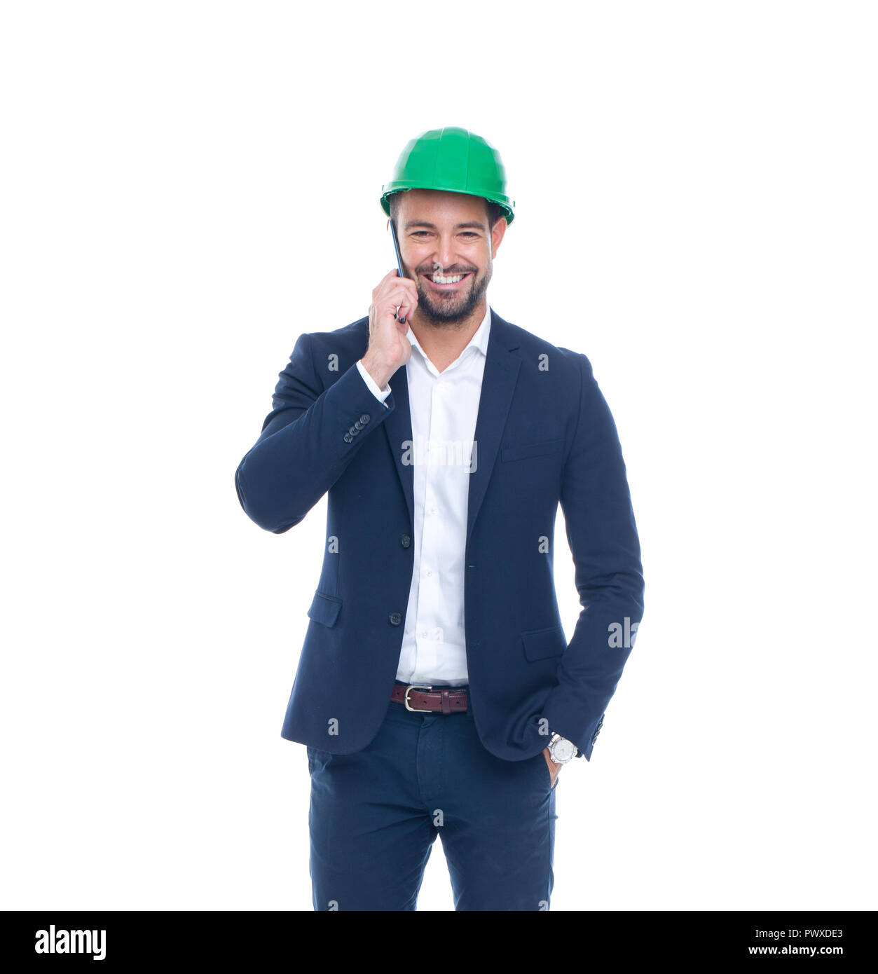 Happy engineer in formal wear and helmet calling isolated on white ...