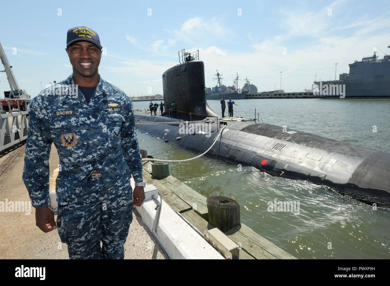 NORFOLK - Lt. j.g. Jeremy Brown stands in front of his assigned ...