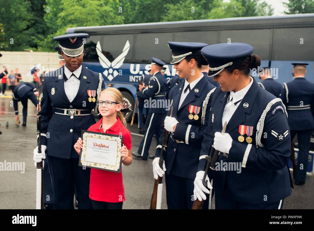 Members of the U.S. Air Force Honor Guard interact with an audience ...