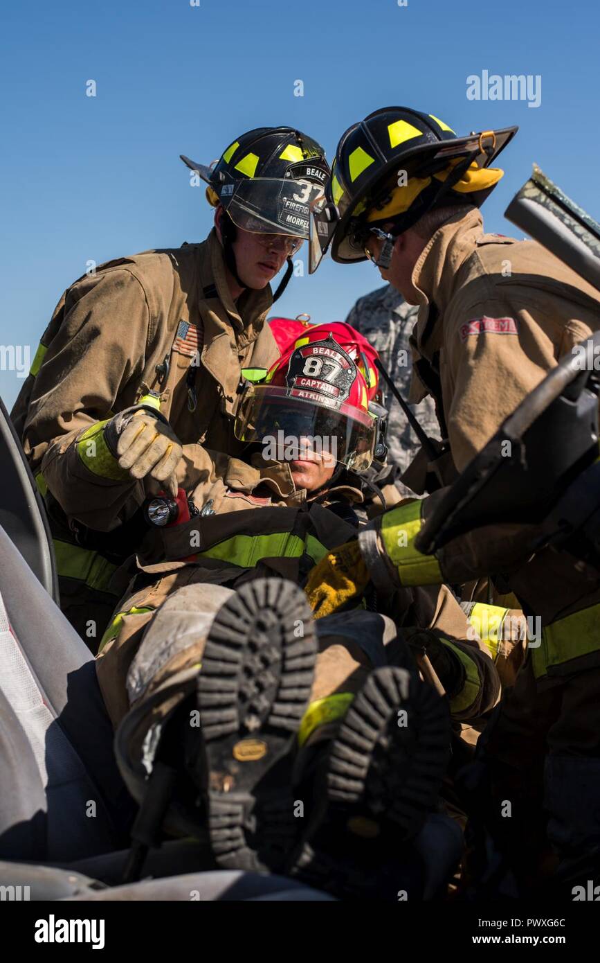 Brian Atkins, 9th Civil Engineer crew captain, is pulled out of a ...