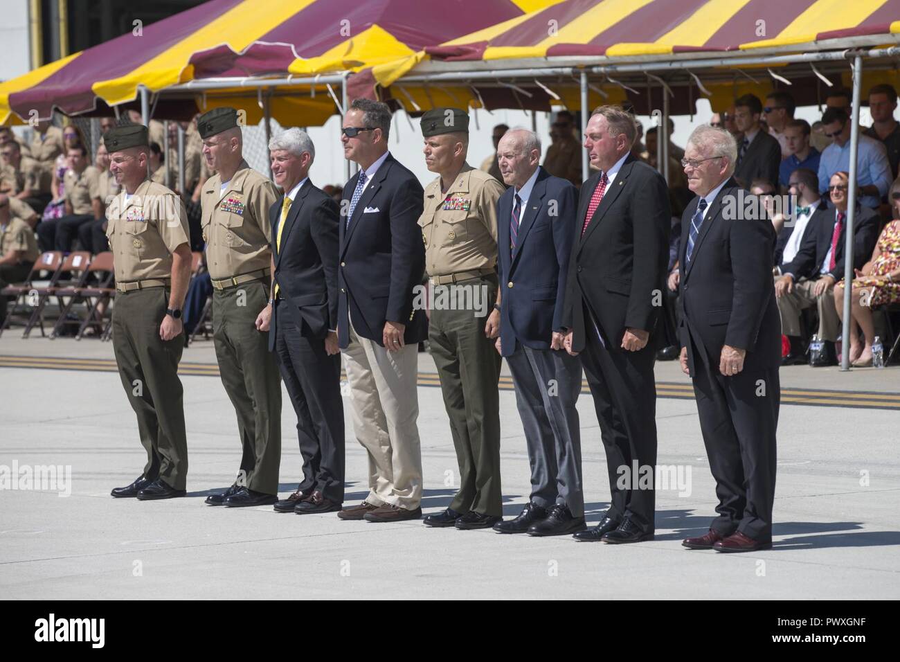 Current and former U.S. Marine squadron commanders stand at attention ...