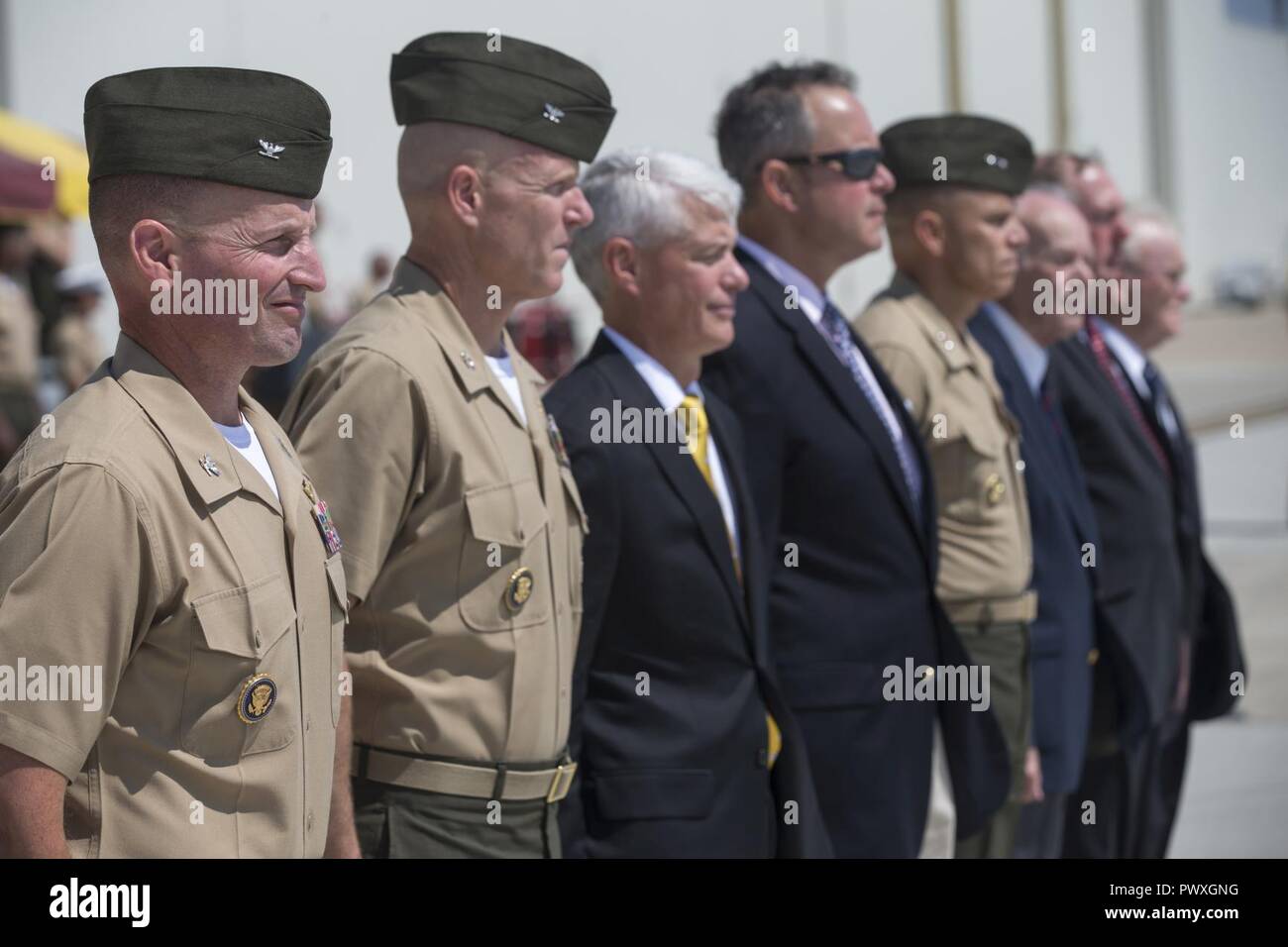 Current and former U.S. Marine squadron commanders stand at attention ...