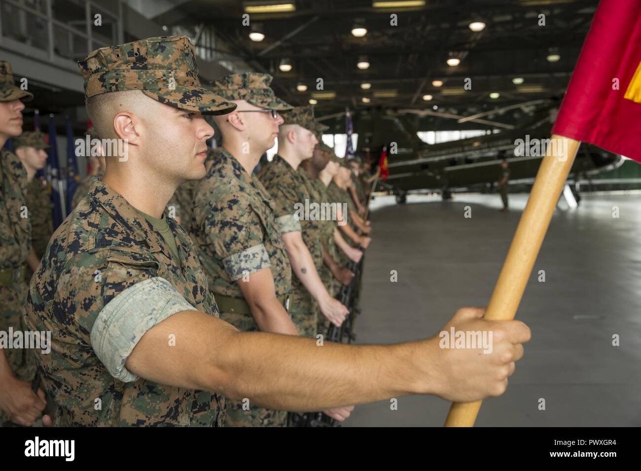 U.S. Marines with Marine Corps Air Facility (MCAF) stand at parade rest ...