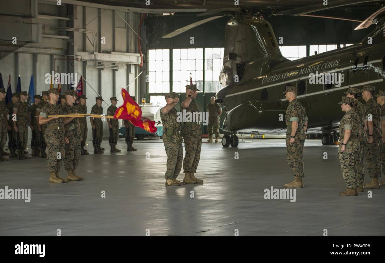 U.S. Marines with Marine Corps Air Facility (MCAF) salute during a ...