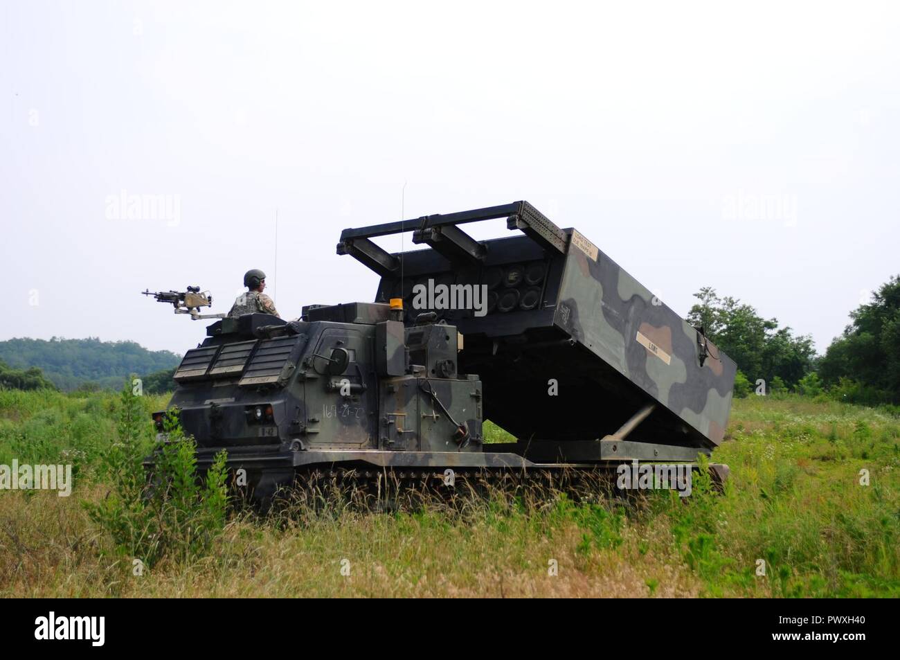 An M270 Multiple Launch Rocket System is in position during a training ...