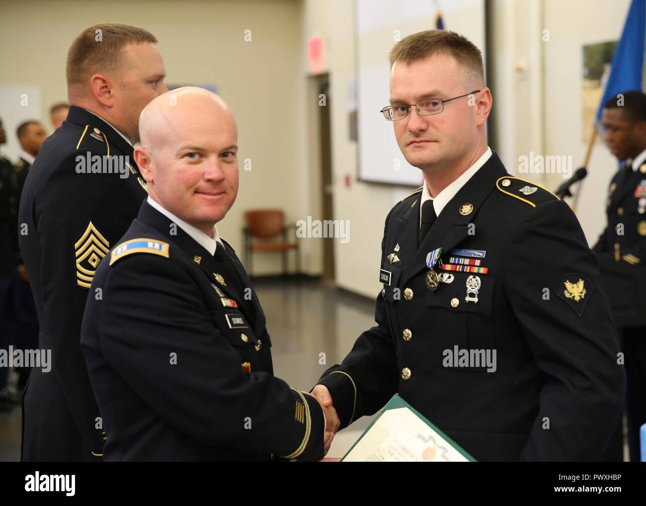 spc-andrew-duncan-is-congratulated-by-capt-alexander-dowds-company