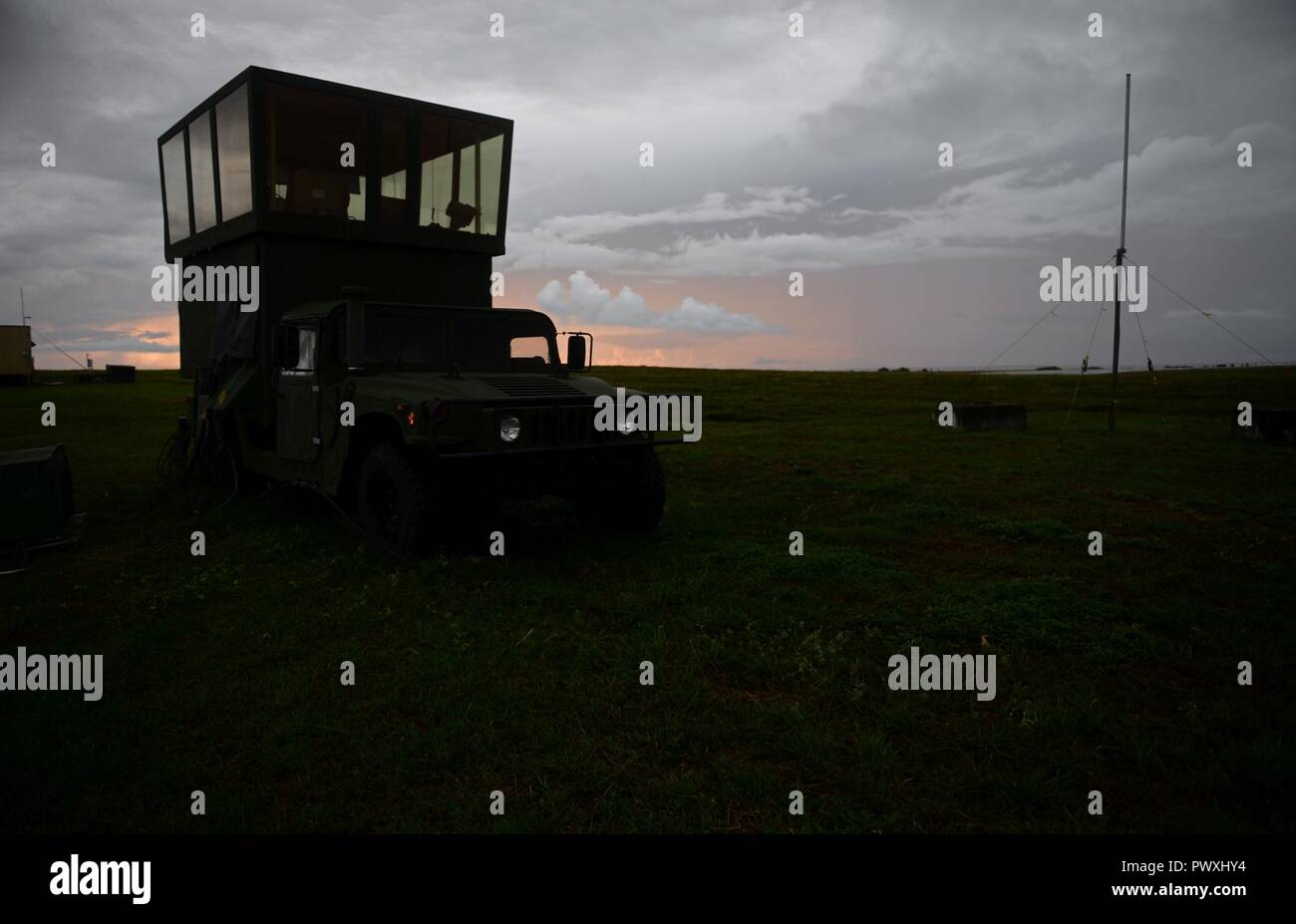The sun rises behind an MSN-7 mobile control tower parked on the ...