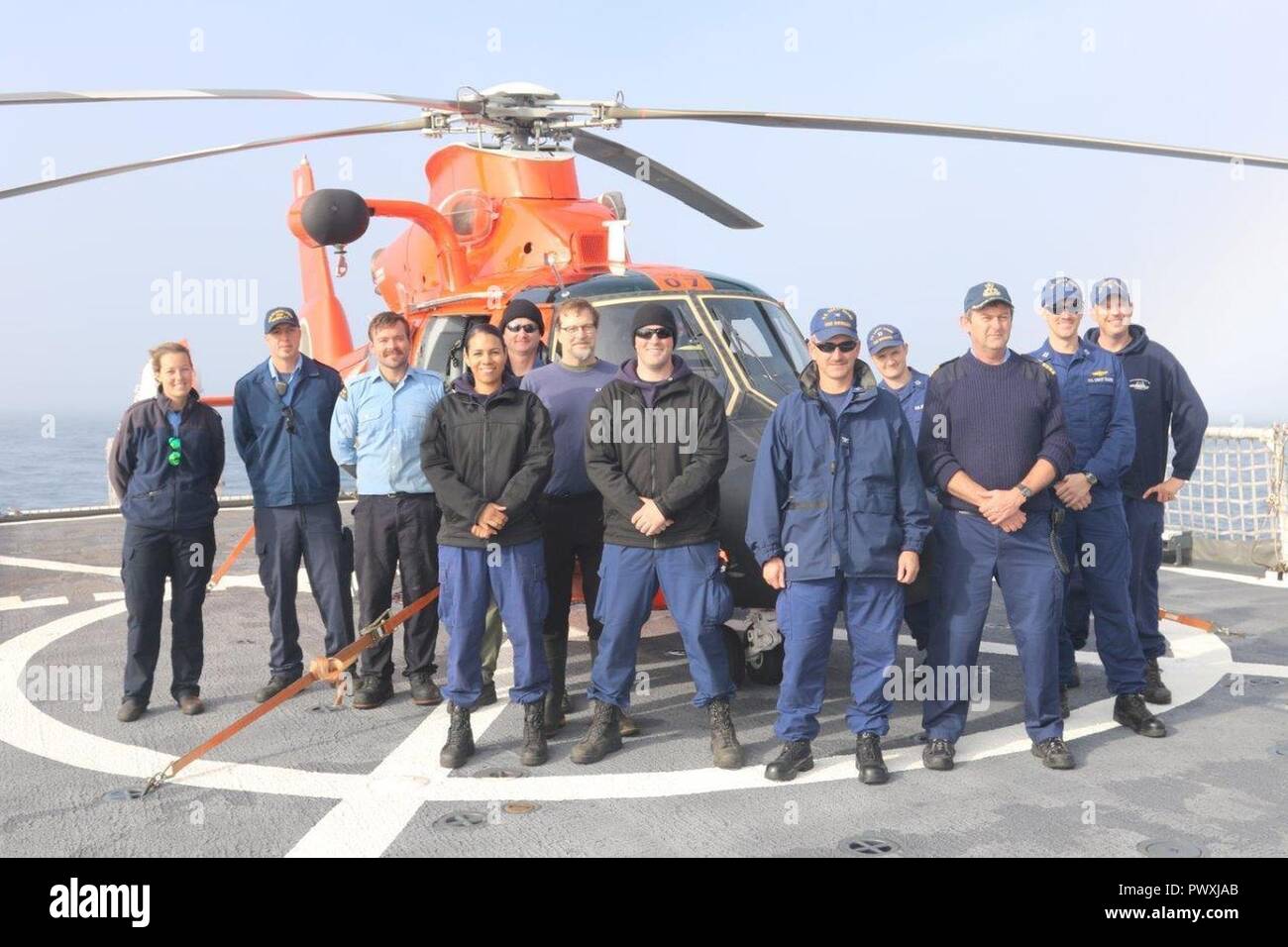 The crew of the Coast Guard Cutter Sherman (WHEC 720) meets with the ...