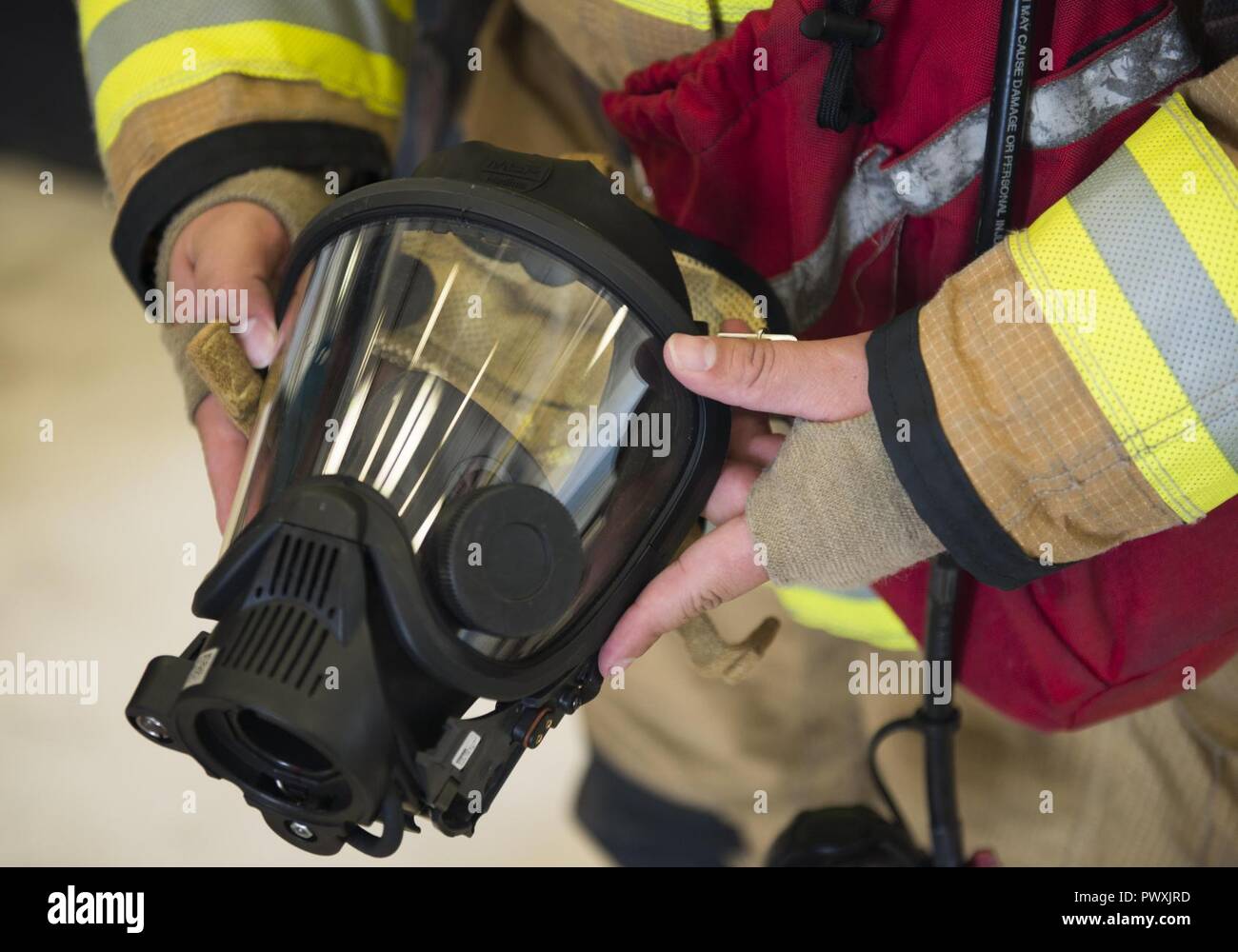 Jeffery Pardo, 502nd Civil Engineering Squadron firefighter, shows off ...