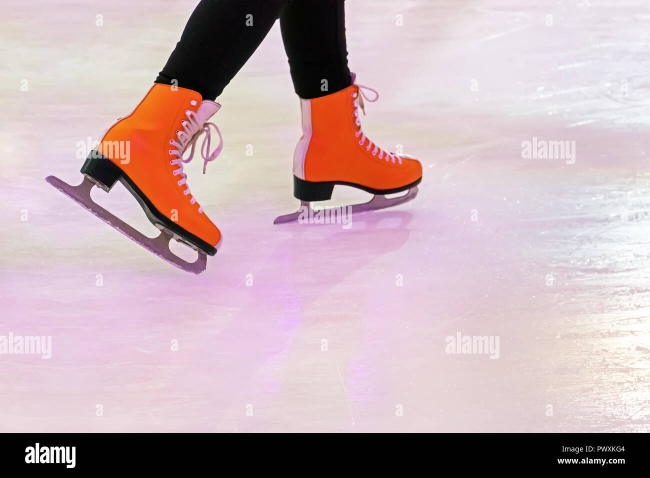 Woman ice skating hi-res stock photography and images - Alamy
