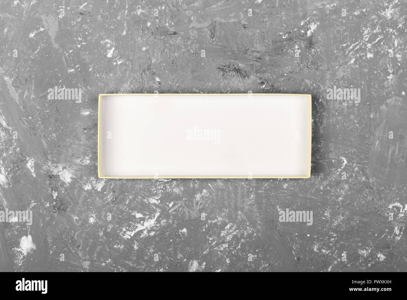 cardboard box on gray cement background surface. top view blank for you ...