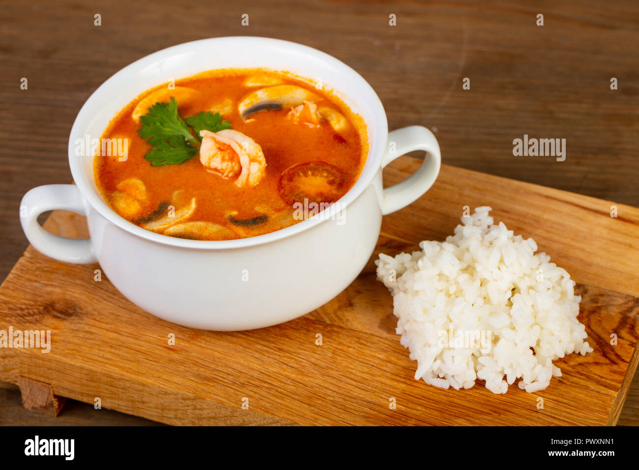 Thai Tom Yam soup with steamed rice Stock Photo - Alamy