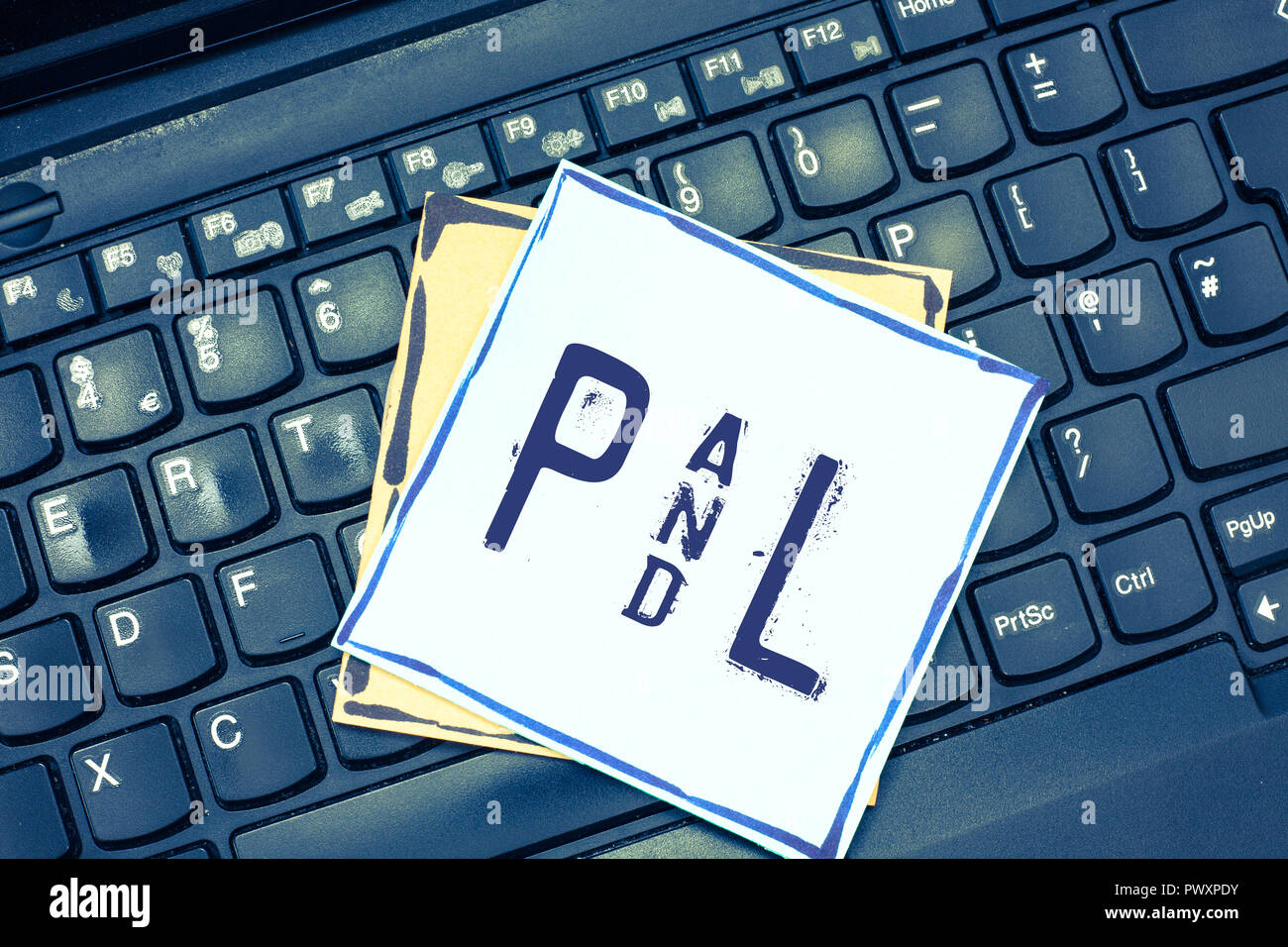 Handwriting text writing P and L. Concept meaning primary financial ...