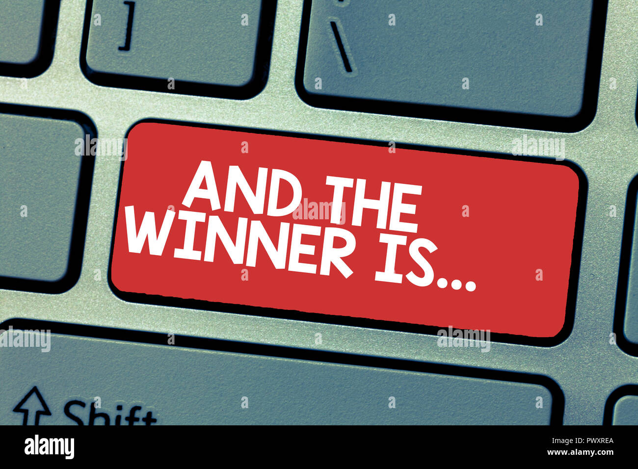 Handwriting text writing And The Winner Is.... Concept meaning ...