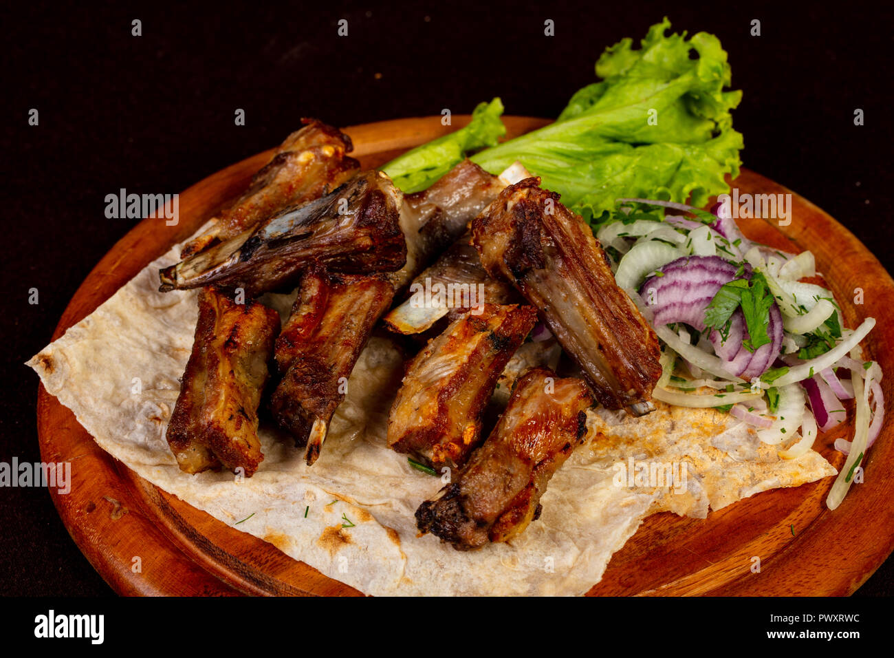 Grilled Mutton ribs with onion Stock Photo - Alamy